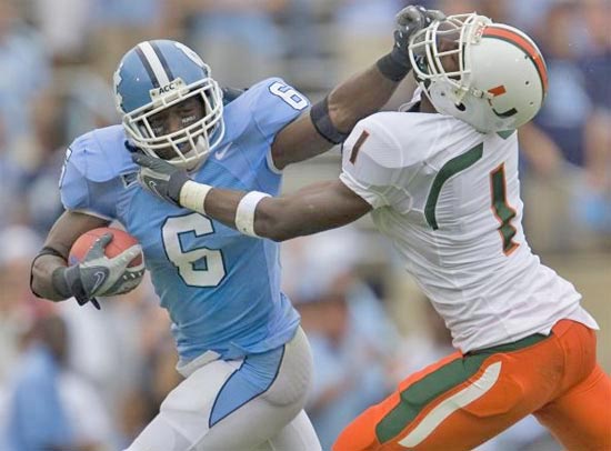 Photo: Anthony Elzy Stiffarms Kenny Phillips - Tar Heel Times